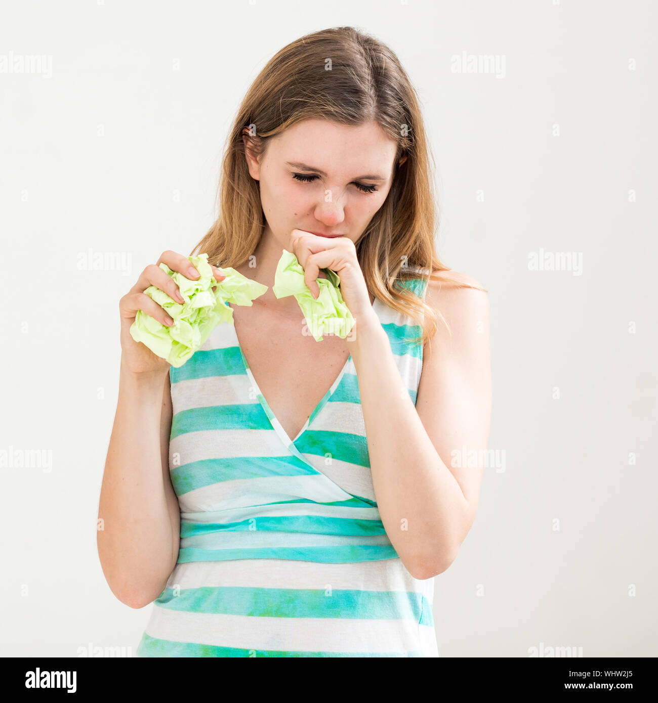 Crying woman holding tissue hi-res stock photography and images - Alamy