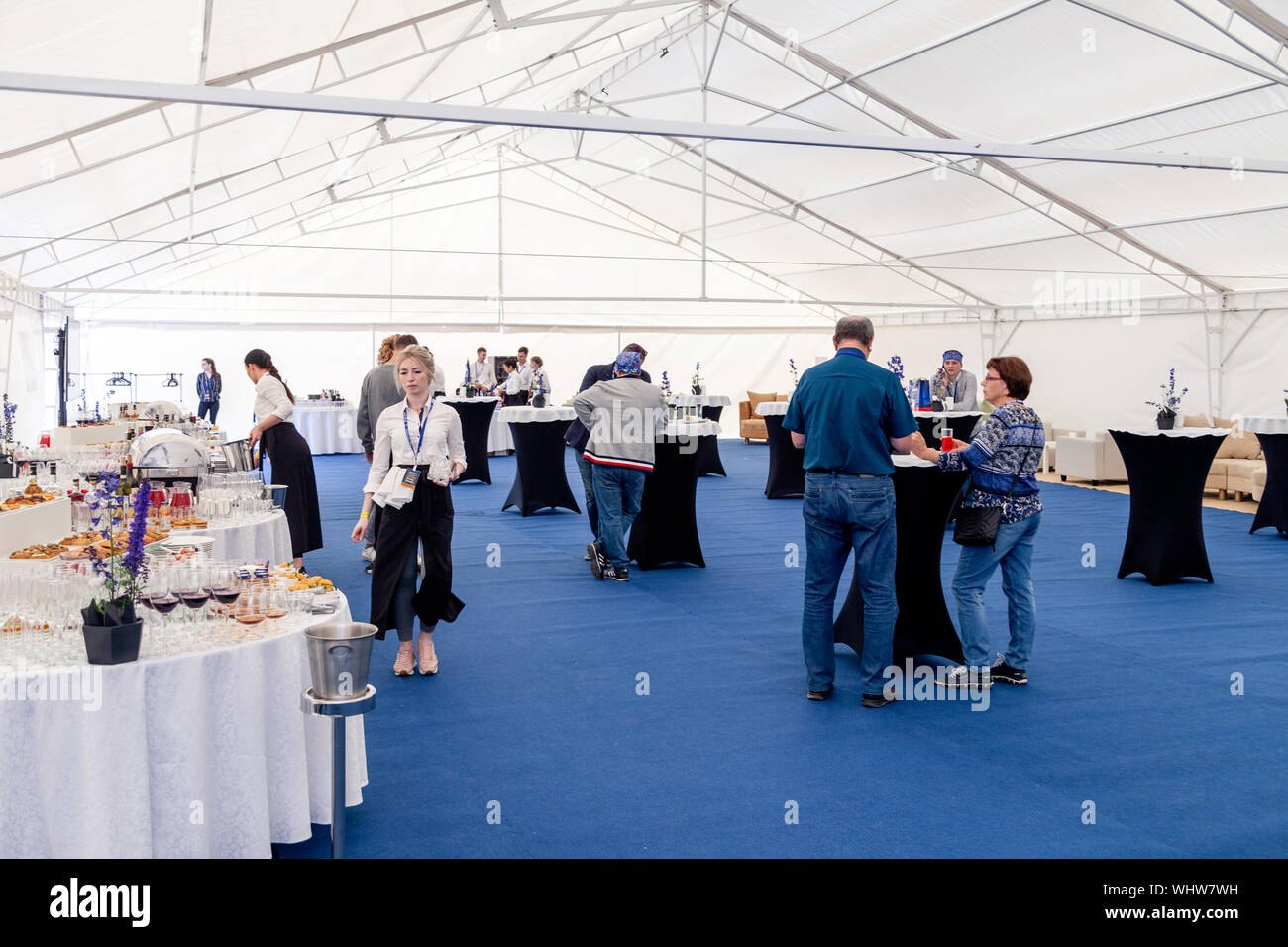 Russia Kemerovo 2019-07-27 People at catering stand-up meal party ...