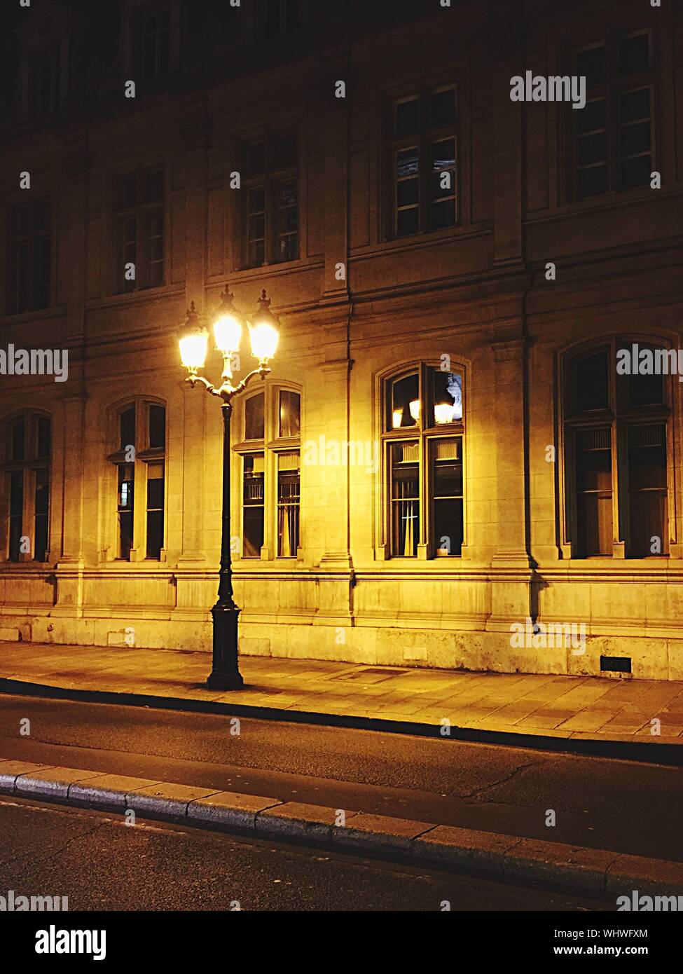Street light on yellow building hi-res stock photography and images - Alamy