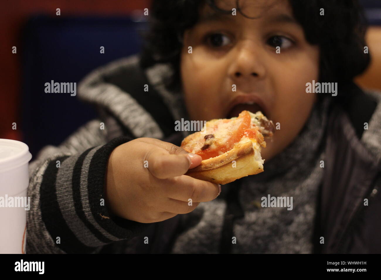 Boy with pizza hi-res stock photography and images - Alamy
