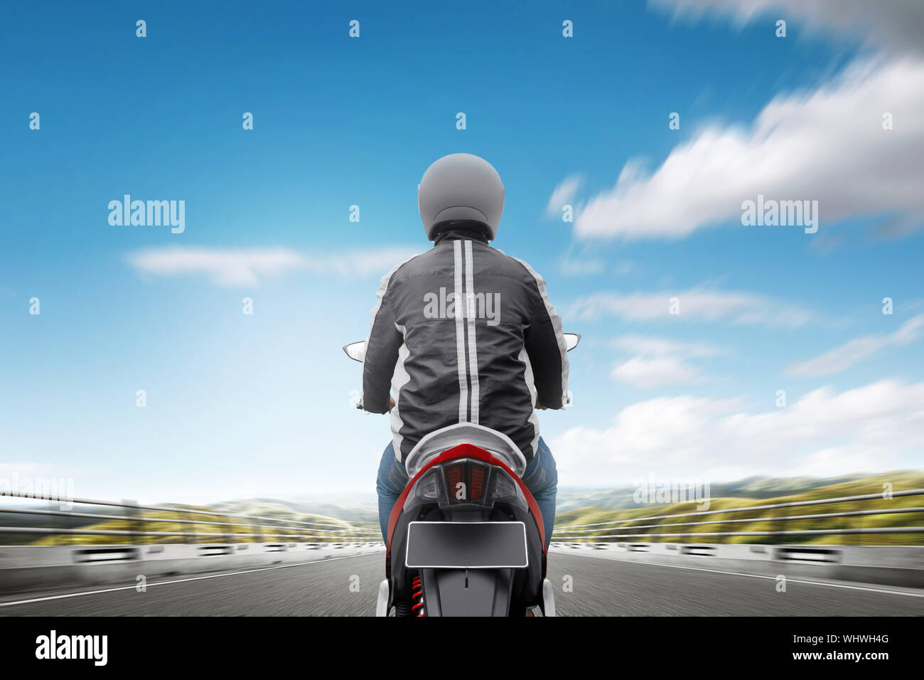 Rear view of Asian motorcycle taxi man driving on the asphalt road on ...