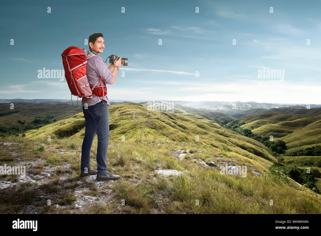 Asian traveler holding camera backpack hi-res stock photography and ...