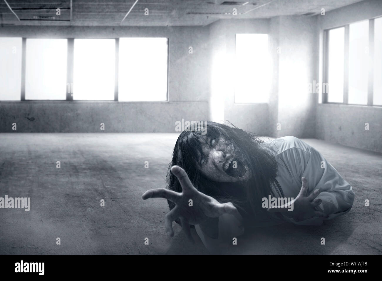 Scary ghost woman with blood and angry face with clawing hands crawling ...