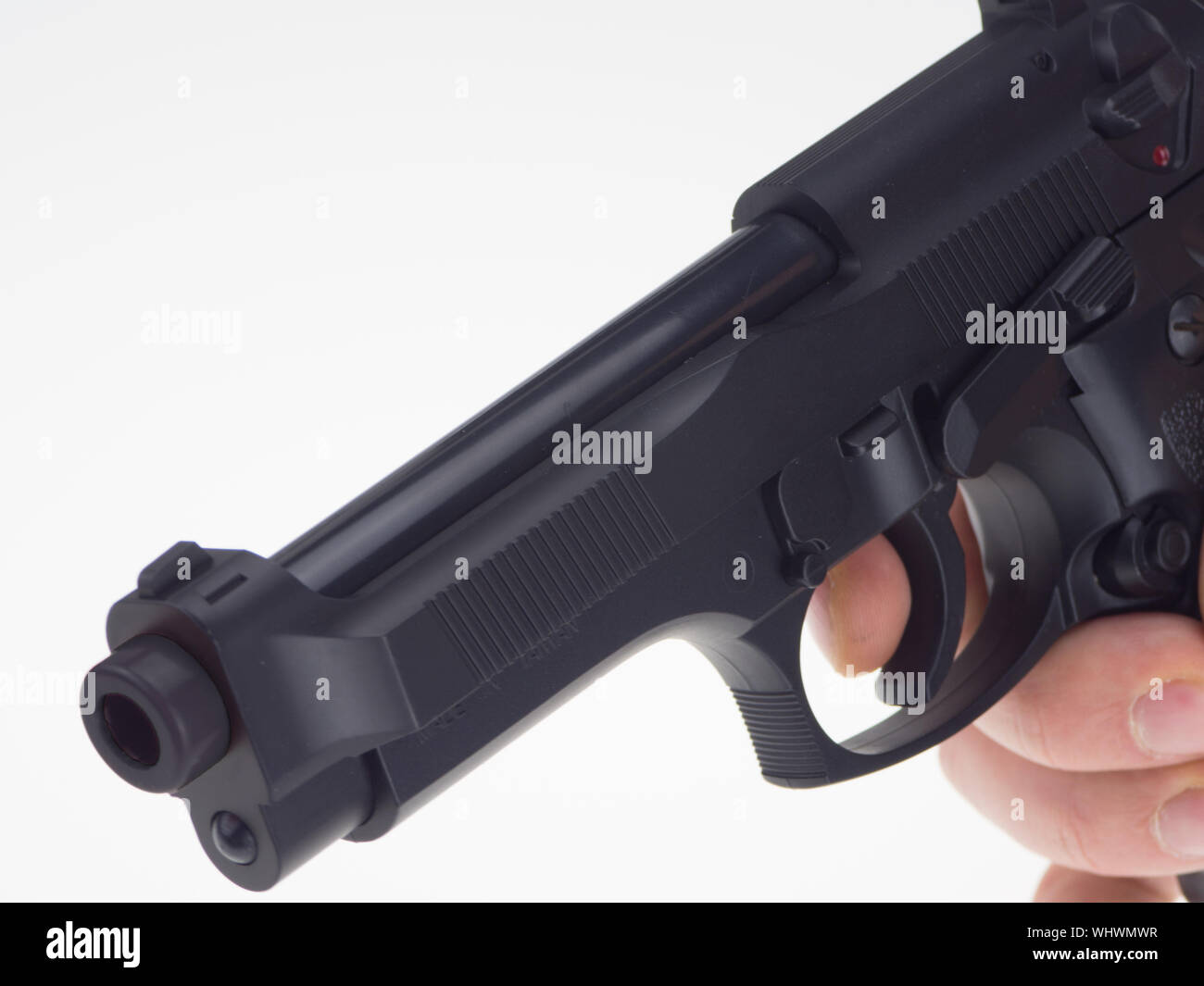 Hand holding gun close up hi-res stock photography and images - Alamy