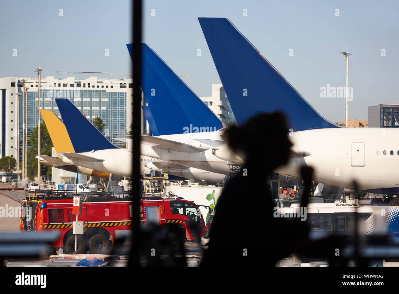 Airport runaway traffic with aeroplanes and cargo vehicles. Busy ...
