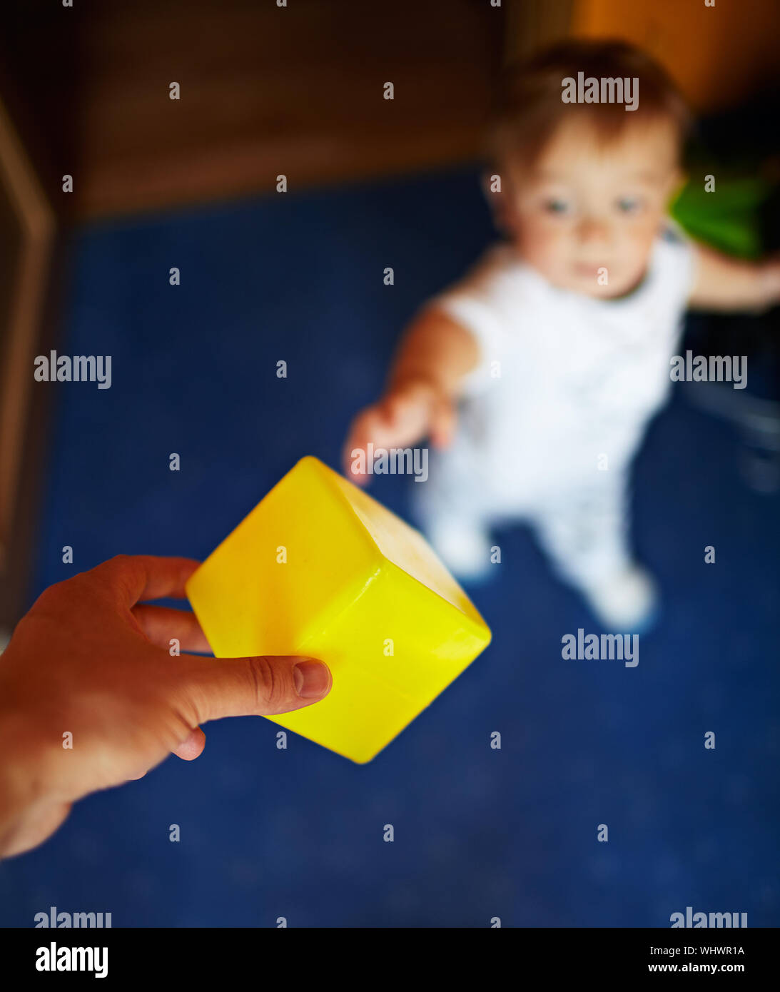 Person giving toy to child hi-res stock photography and images - Alamy