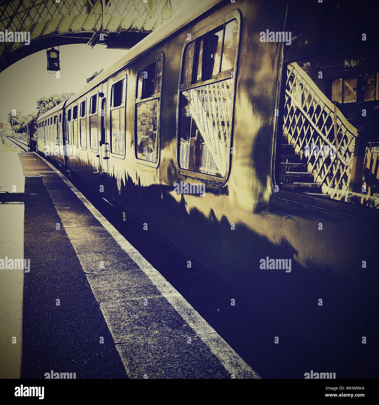 View Of Train At Railroad Station Platform Stock Photo - Alamy