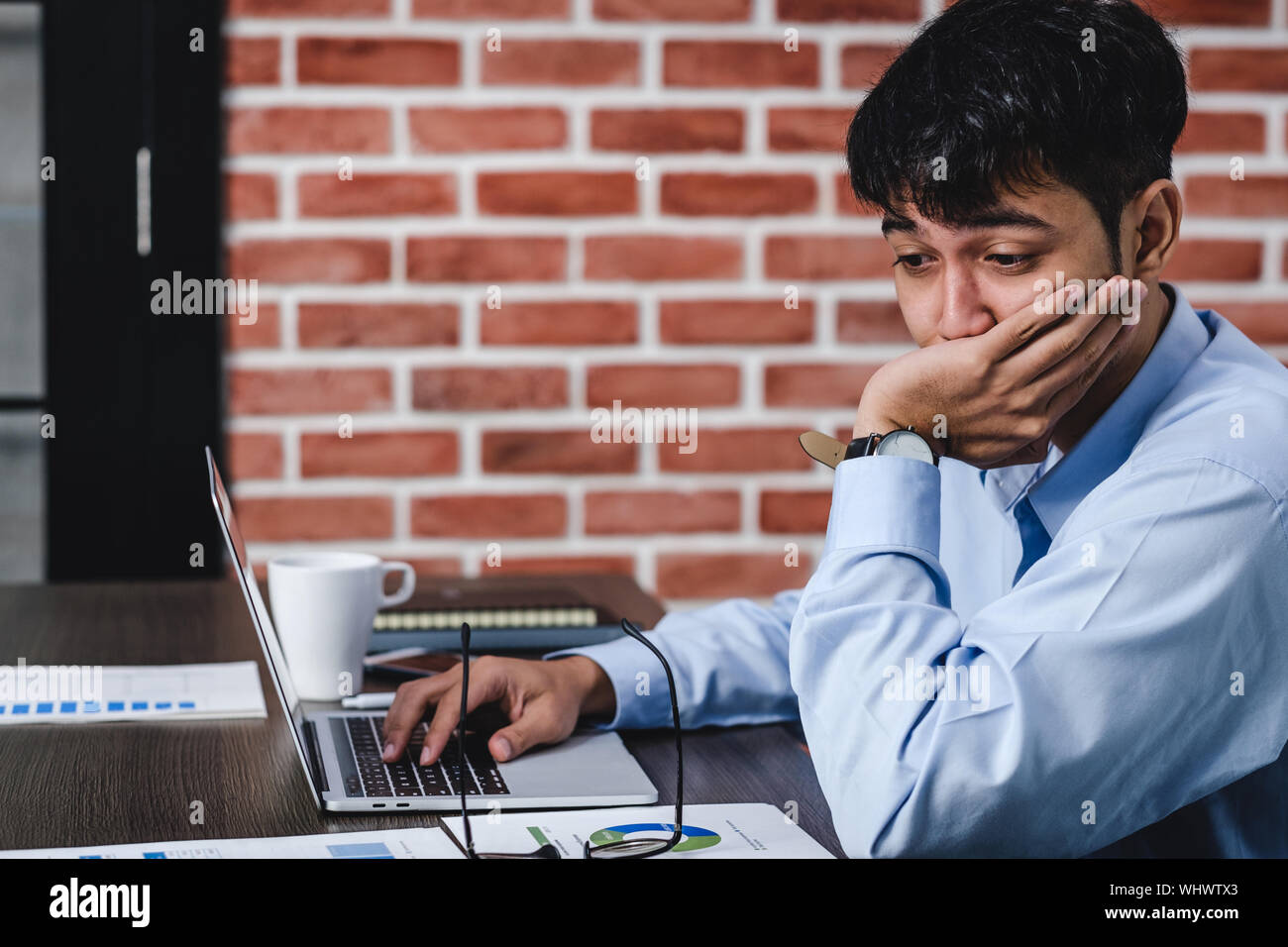 asian businessman get stress and headache when working with laptop on ...