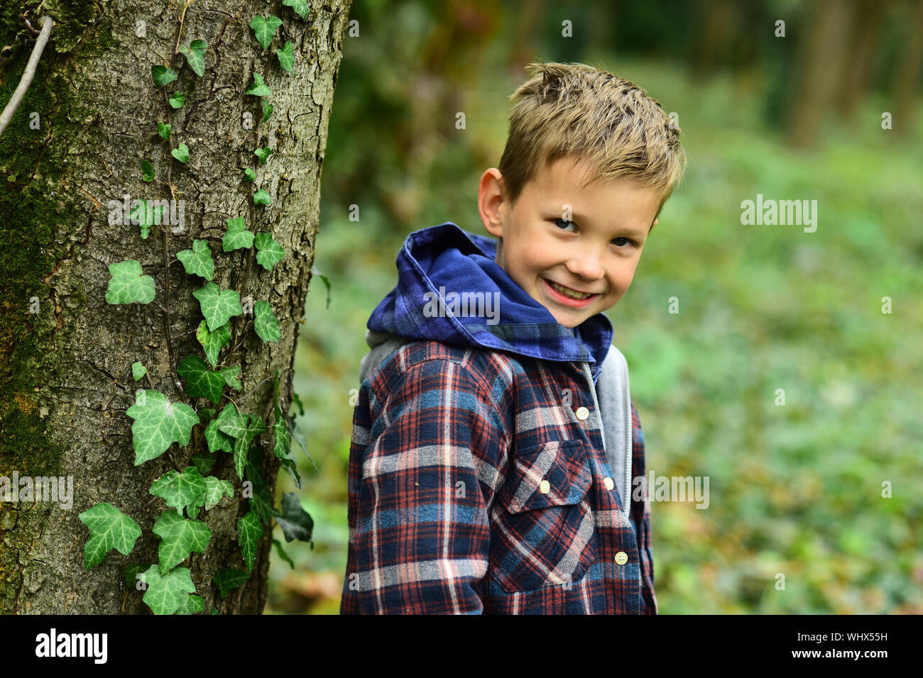 Small boy enjoy childrens day. Small boy play on autumn day. Protecting ...