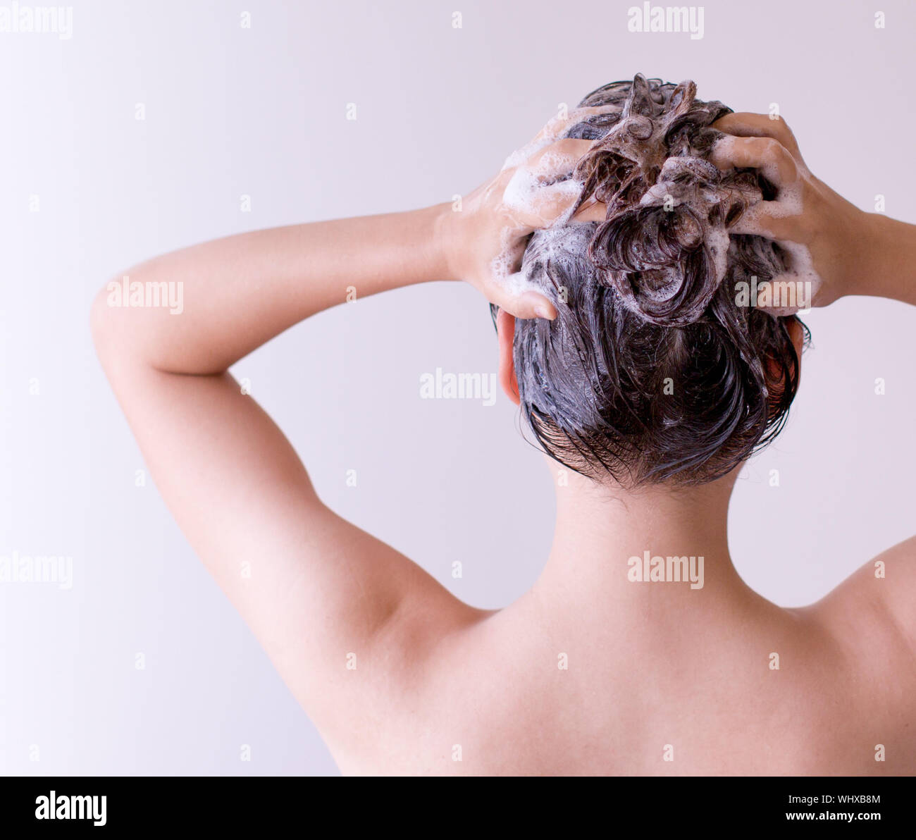 Asian girl shampooing hair hi-res stock photography and images - Alamy