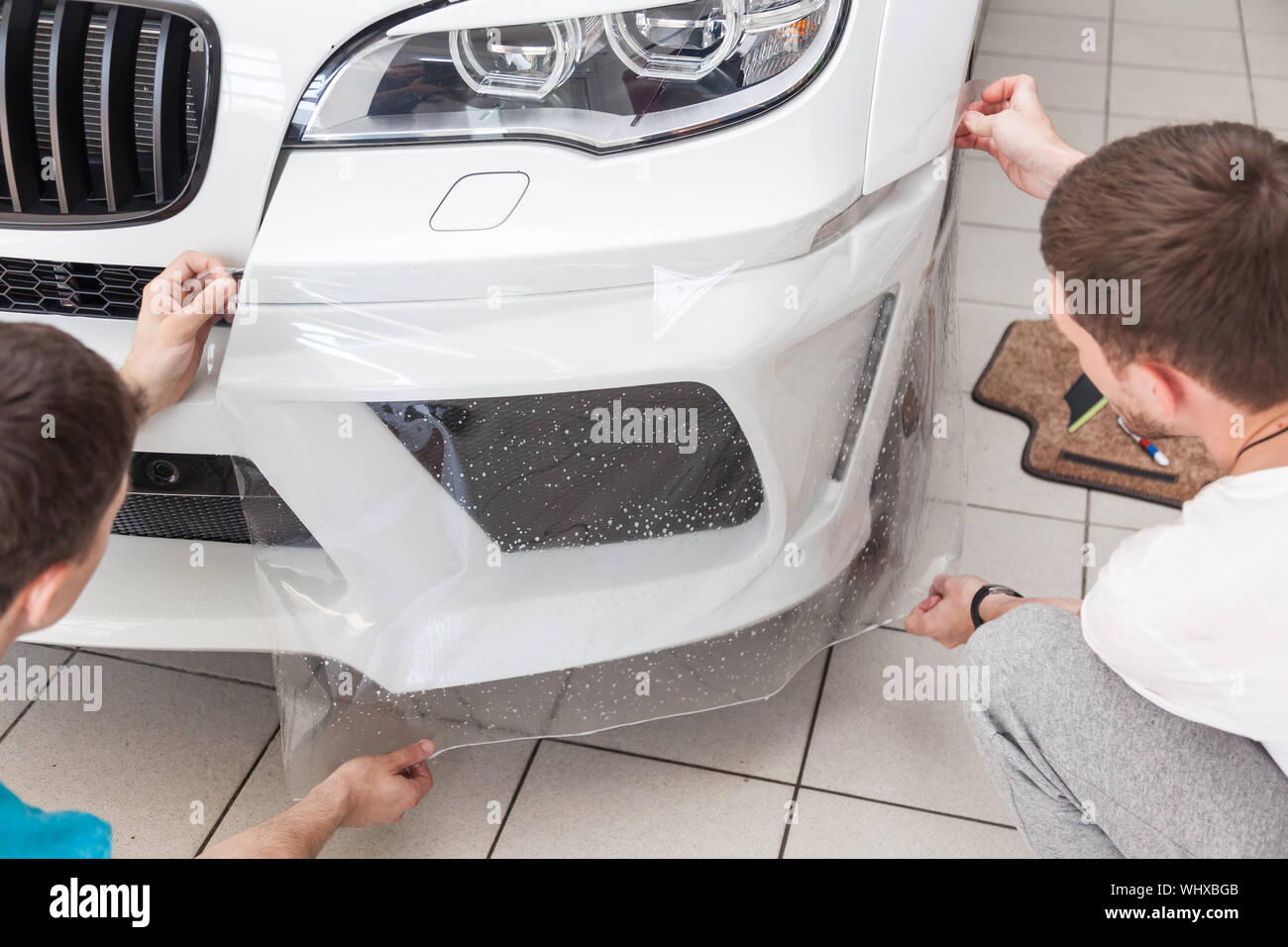 Retrofitting the car with a solid transparent protective film, the ...