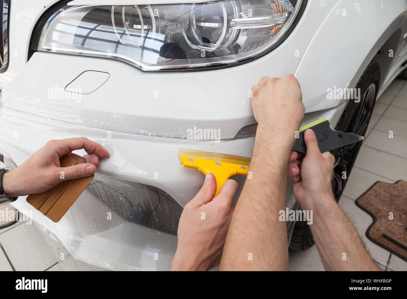 Retrofitting the car with a solid transparent protective film, the ...