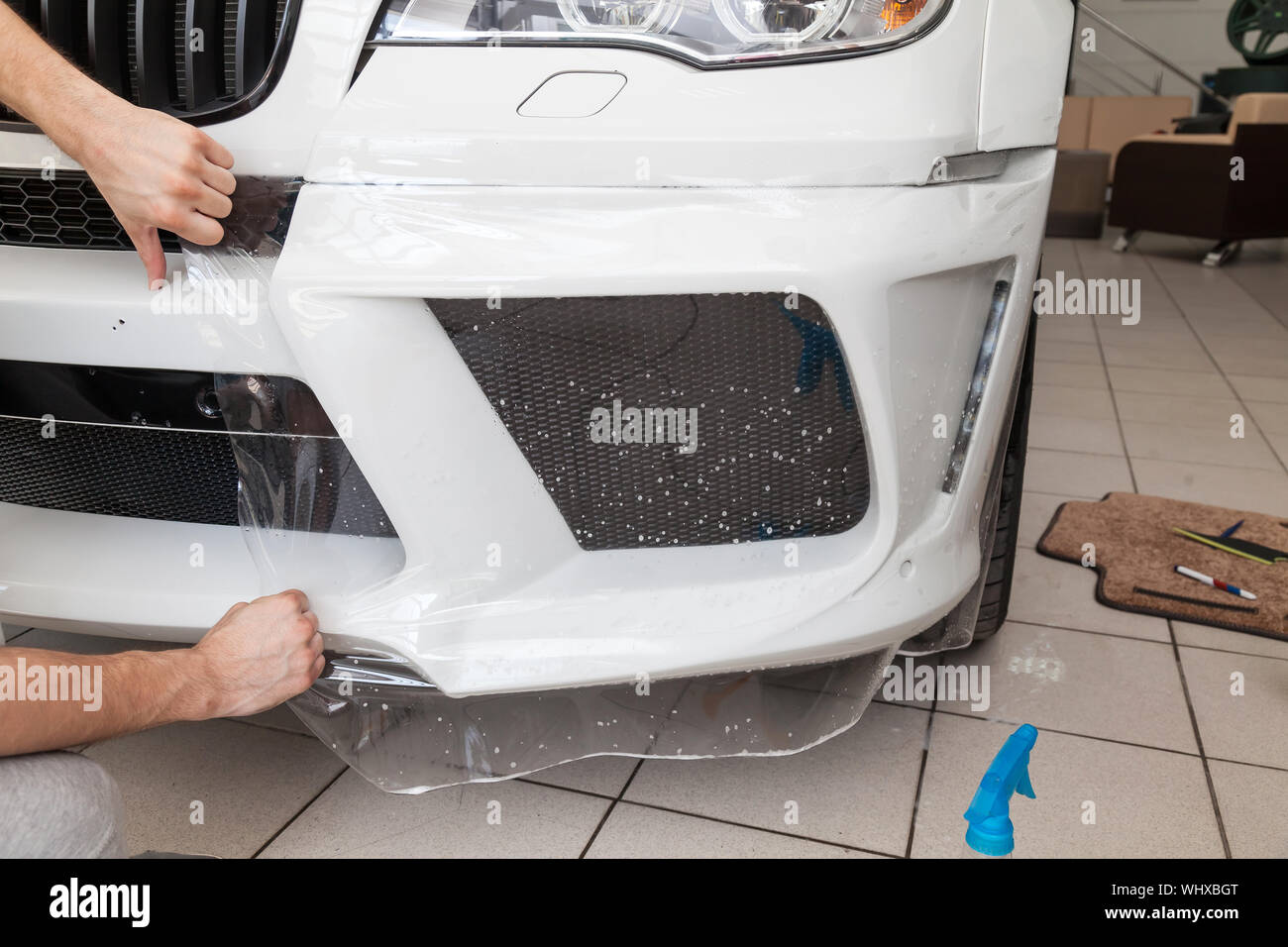Retrofitting the car with a solid transparent protective film, the ...