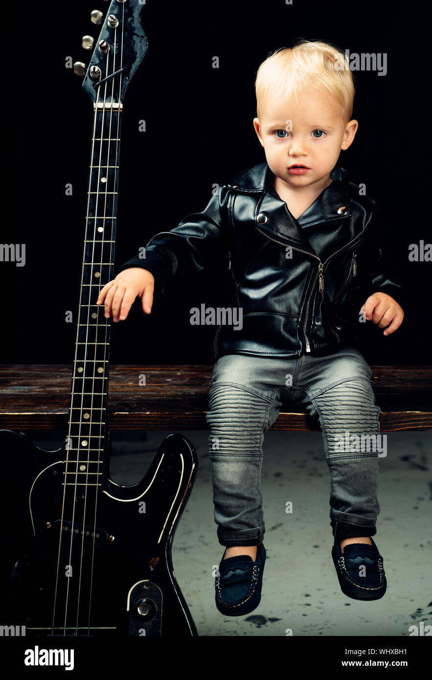 Make some noise. Little rock star. Child boy with guitar. Little ...