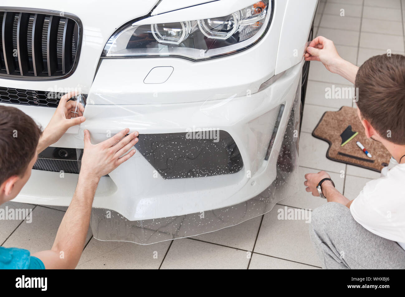 Retrofitting the car with a solid transparent protective film, the ...