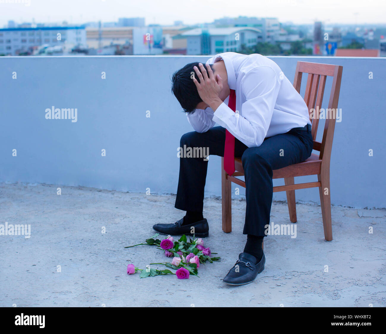 Symbolism of being rejected. Man trashing the flowers he wanted to give ...