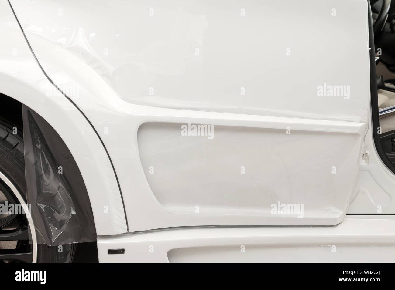Retrofitting the car with a solid transparent protective film, the ...