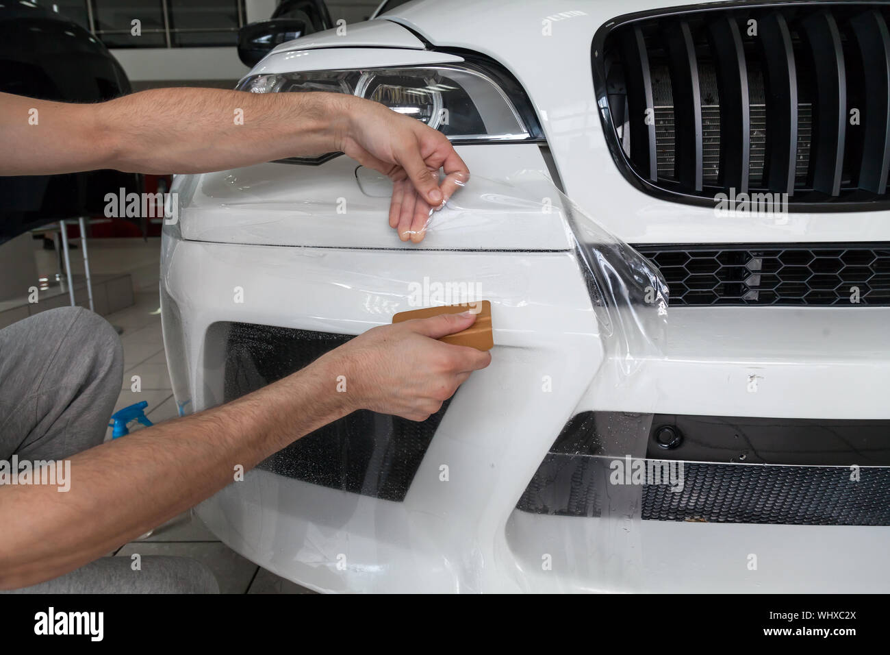 Retrofitting the car with a solid transparent protective film, the ...