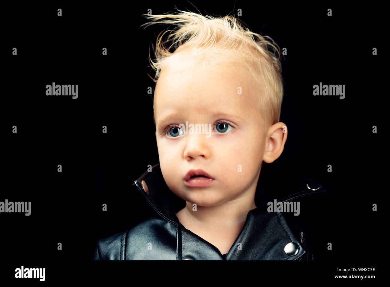 Rock style child. Rock and roll fashion trend. Adorable small music fan ...