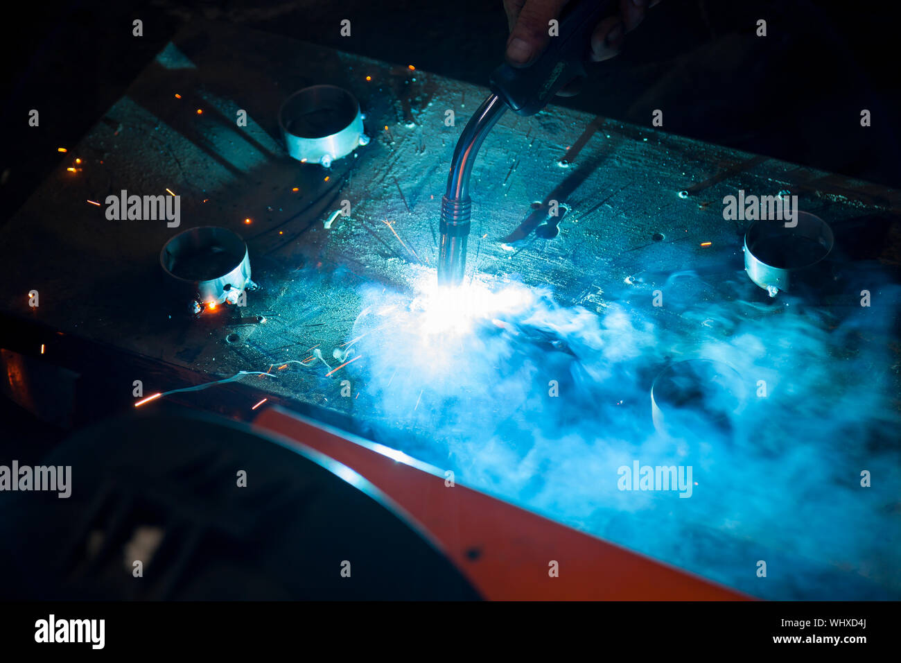 Semi-automatic spot welding of metal parts during the work of the ...