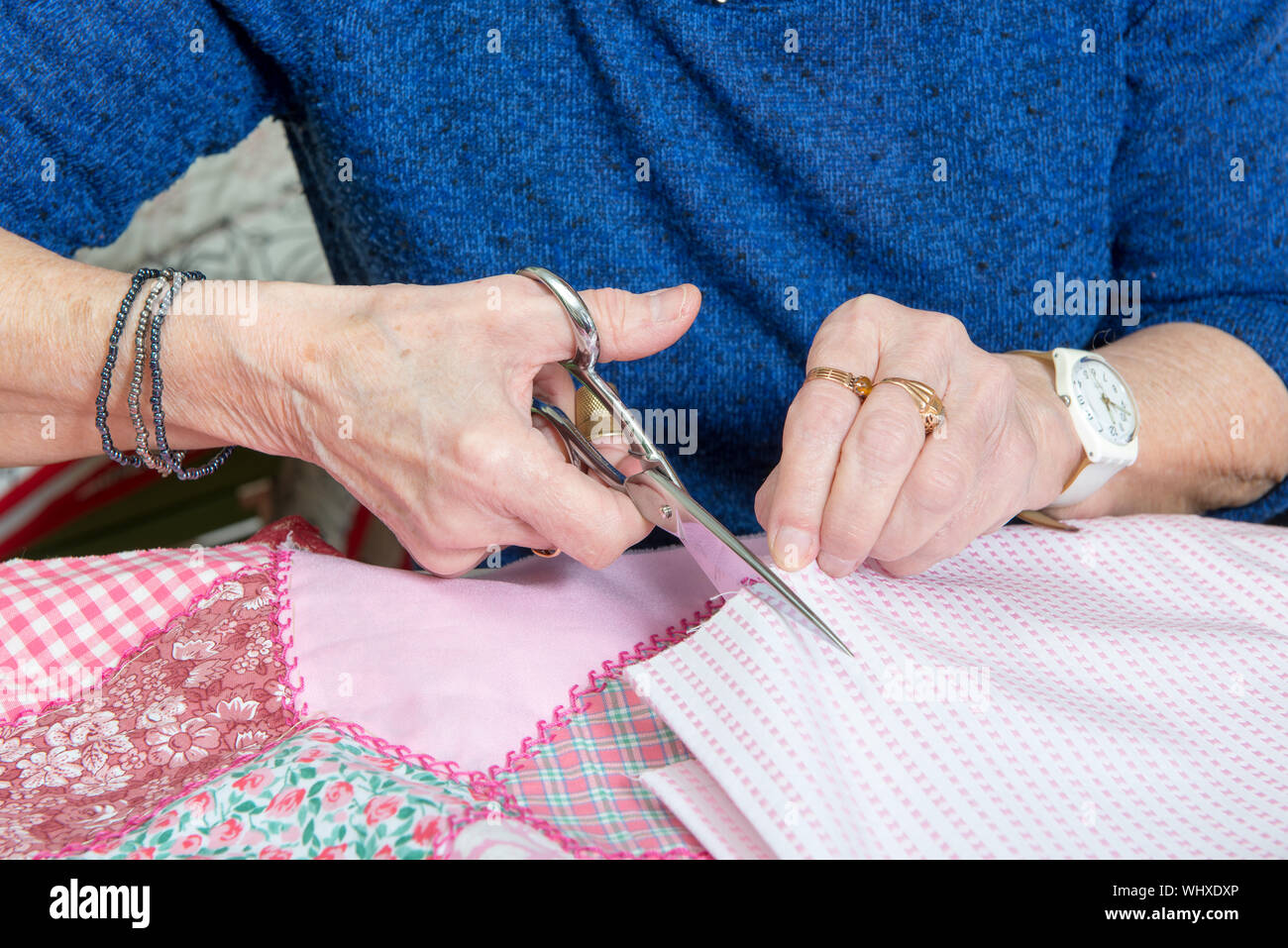 Woman cutting fabric hi-res stock photography and images - Alamy