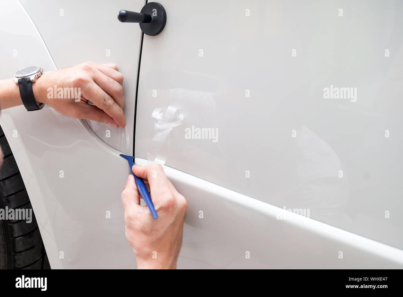 Retrofitting the car with a solid transparent protective film, the ...