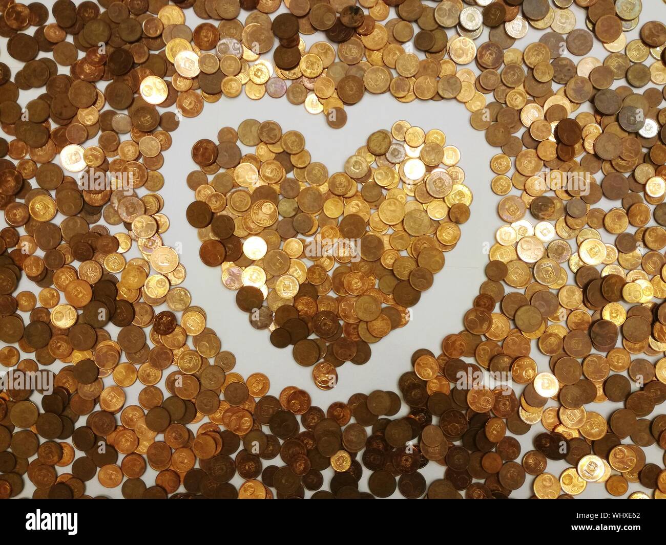 Heart of coins hi-res stock photography and images - Alamy