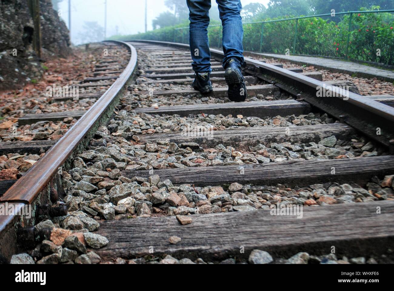 Man walking on railway track hi-res stock photography and images - Alamy