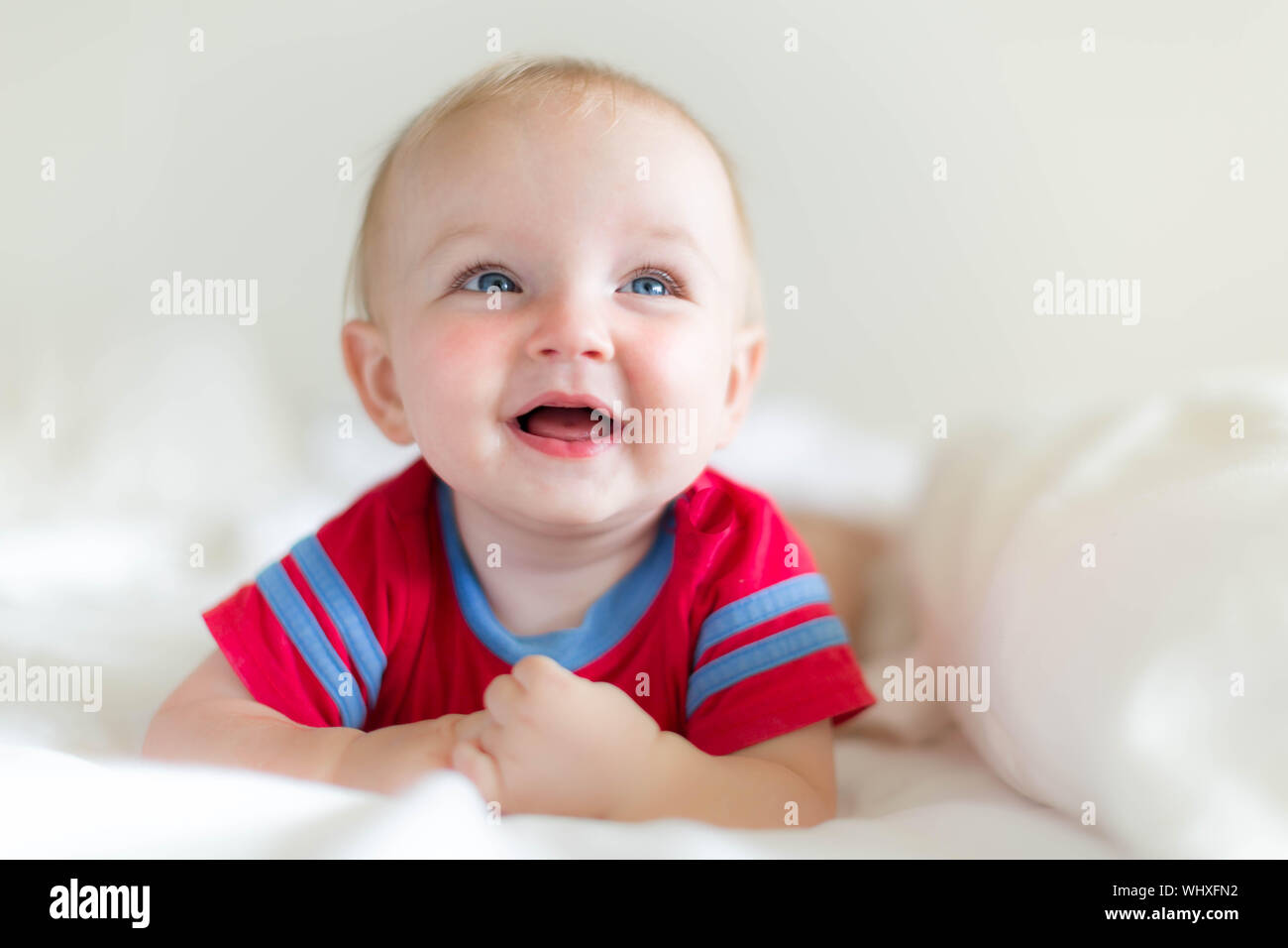 Caucasian baby, front profile, smiling Stock Photo - Alamy
