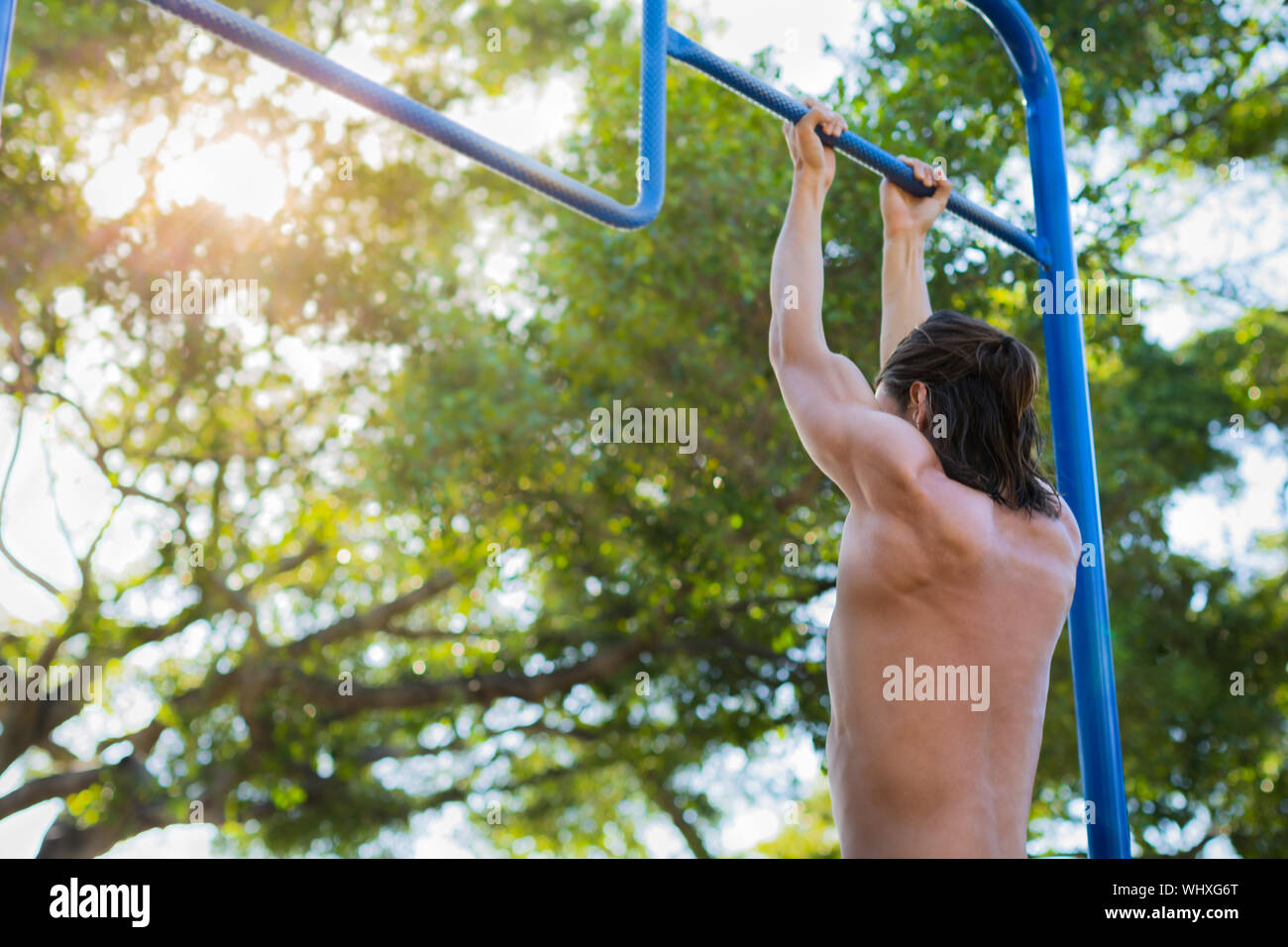 calisthenics. toned and ripped man. athletic. fitness training. green ...