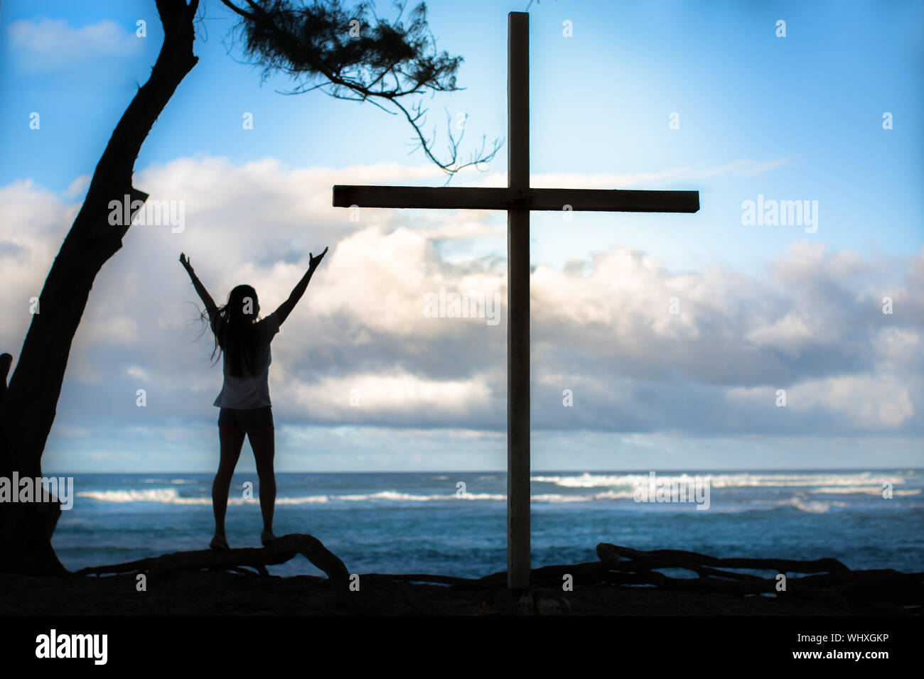 Woman Praying At The Cross