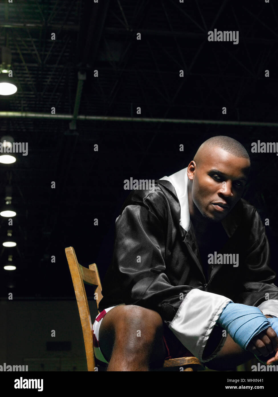 Portrait of an African American boxer sitting on chair Stock Photo - Alamy