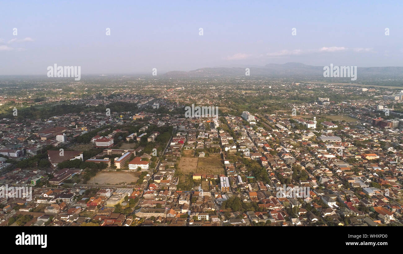 cityscape Yogyakarta with buildings, highway at sunset time. aerial ...