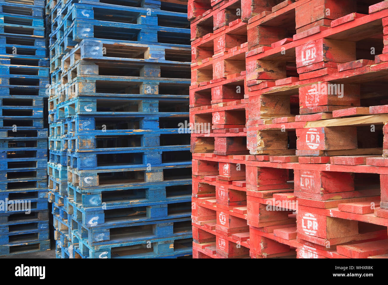 Closeup of stacks of pallets Stock Photo - Alamy