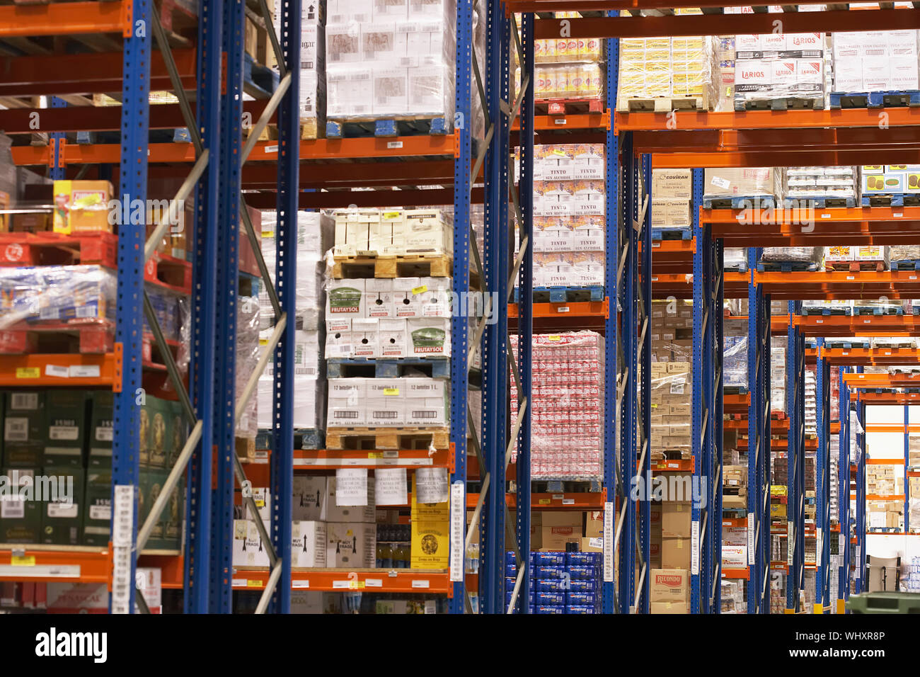 View of shelves in warehouse full of merchandise Stock Photo - Alamy