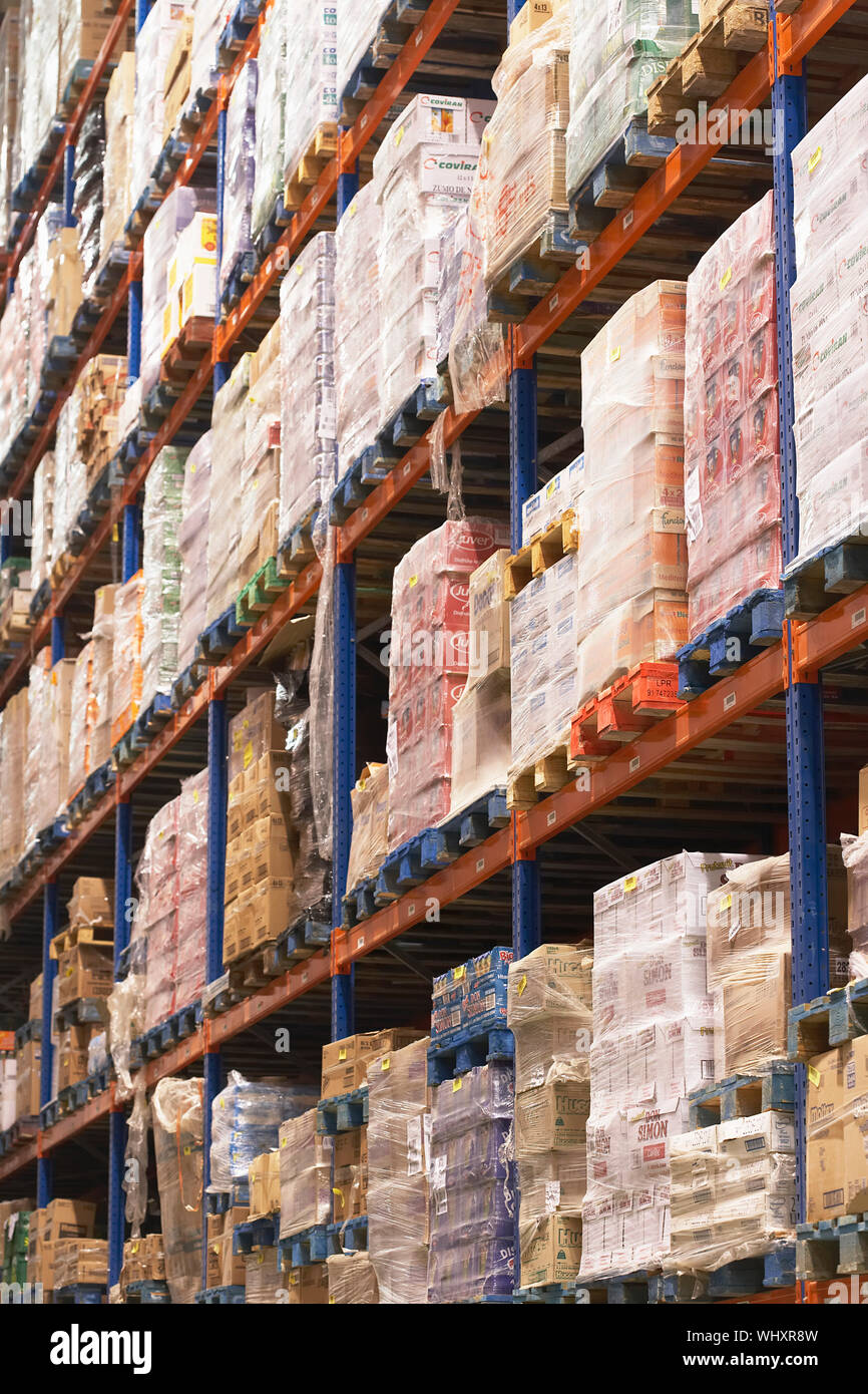 Low angle view of shelves in warehouse full of merchandise Stock Photo ...