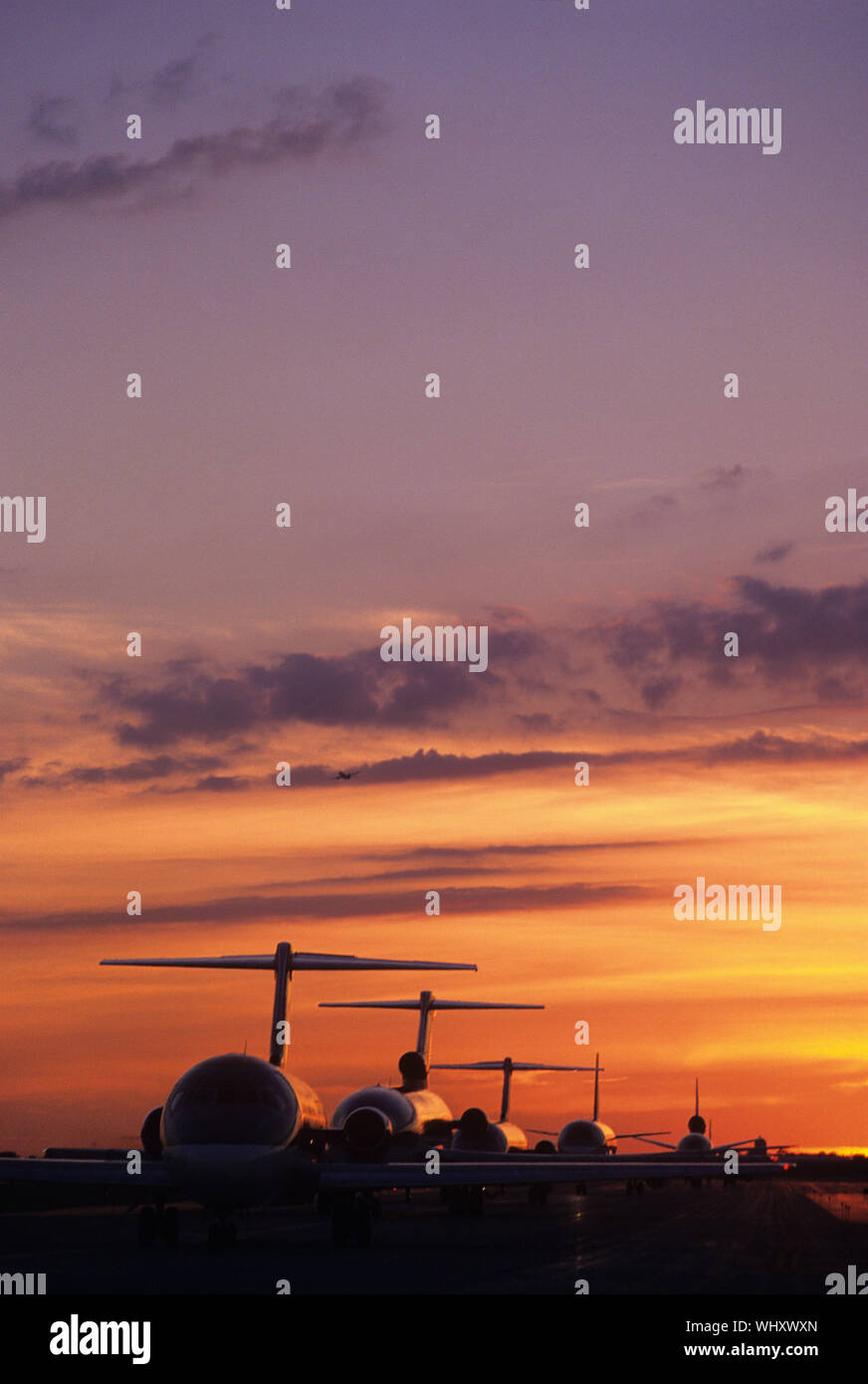 Planes Sitting on Tarmac at Sunset Stock Photo - Alamy