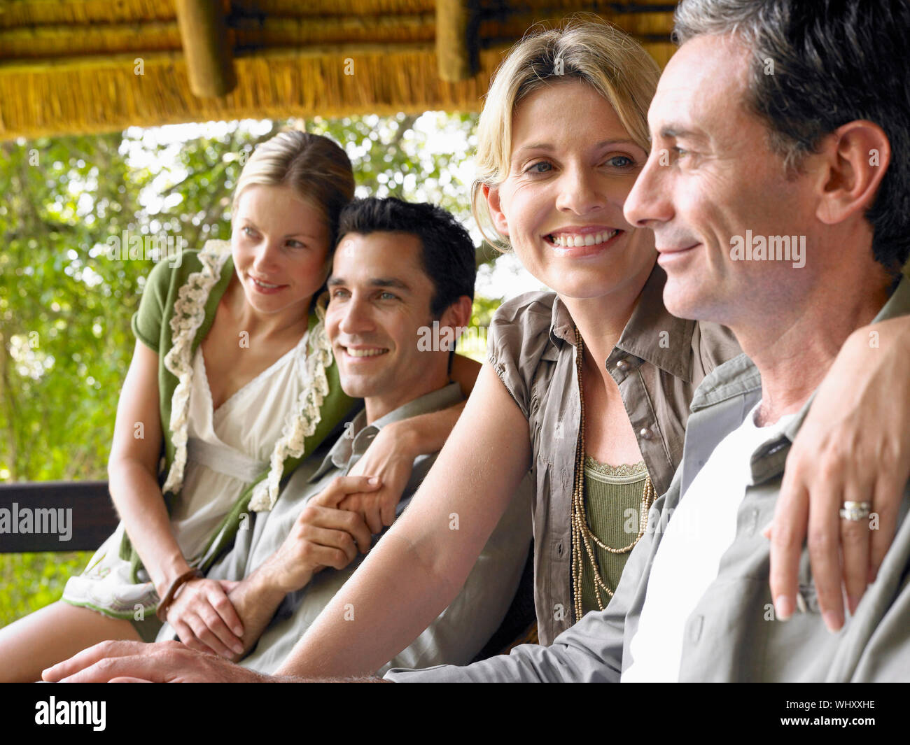 Two couples sitting on terrace hi-res stock photography and images - Alamy