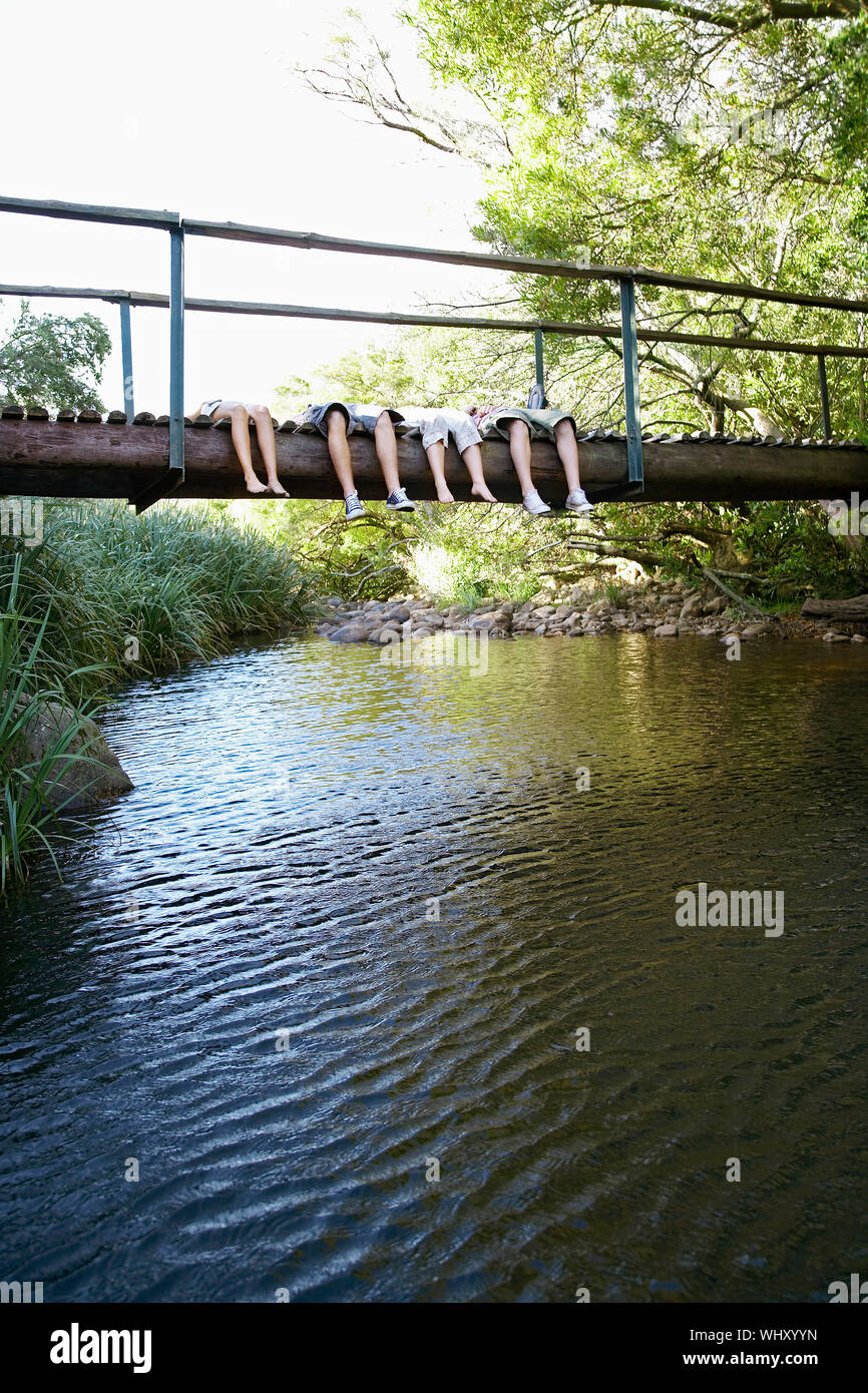Girl lying on wooden bridge hi-res stock photography and images - Alamy
