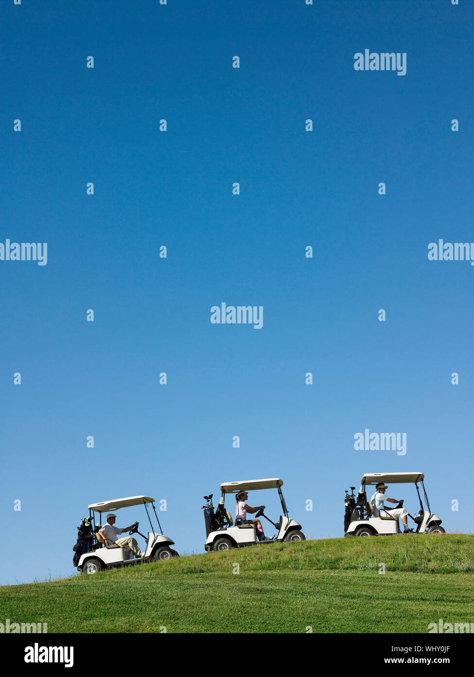 People driving golf carts hi-res stock photography and images - Alamy