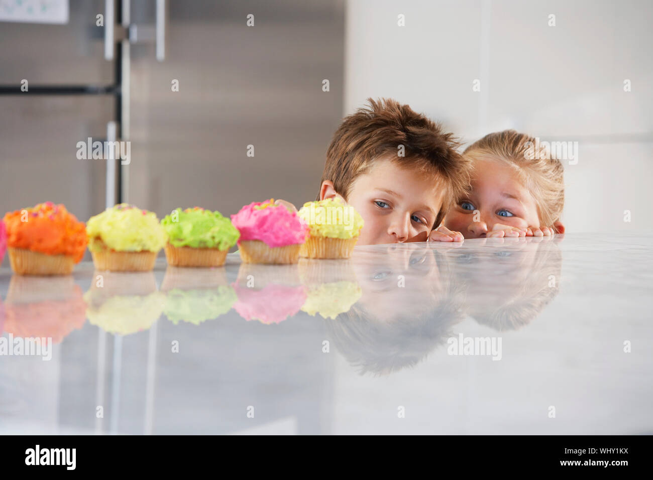 Child peeking over table hi-res stock photography and images - Alamy