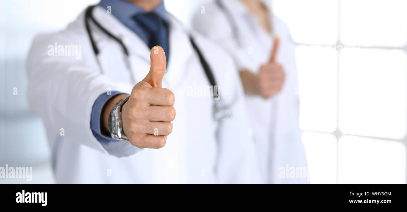 Group of doctors cheerful smiling at camera, thumbs up. Perfect medical ...
