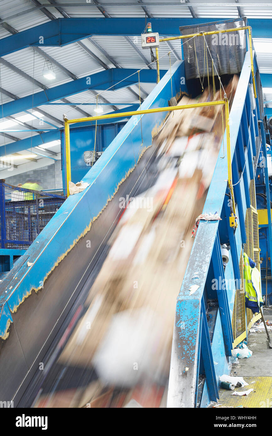 Motion of rubbish on conveyor belt in recycling factory Stock Photo - Alamy
