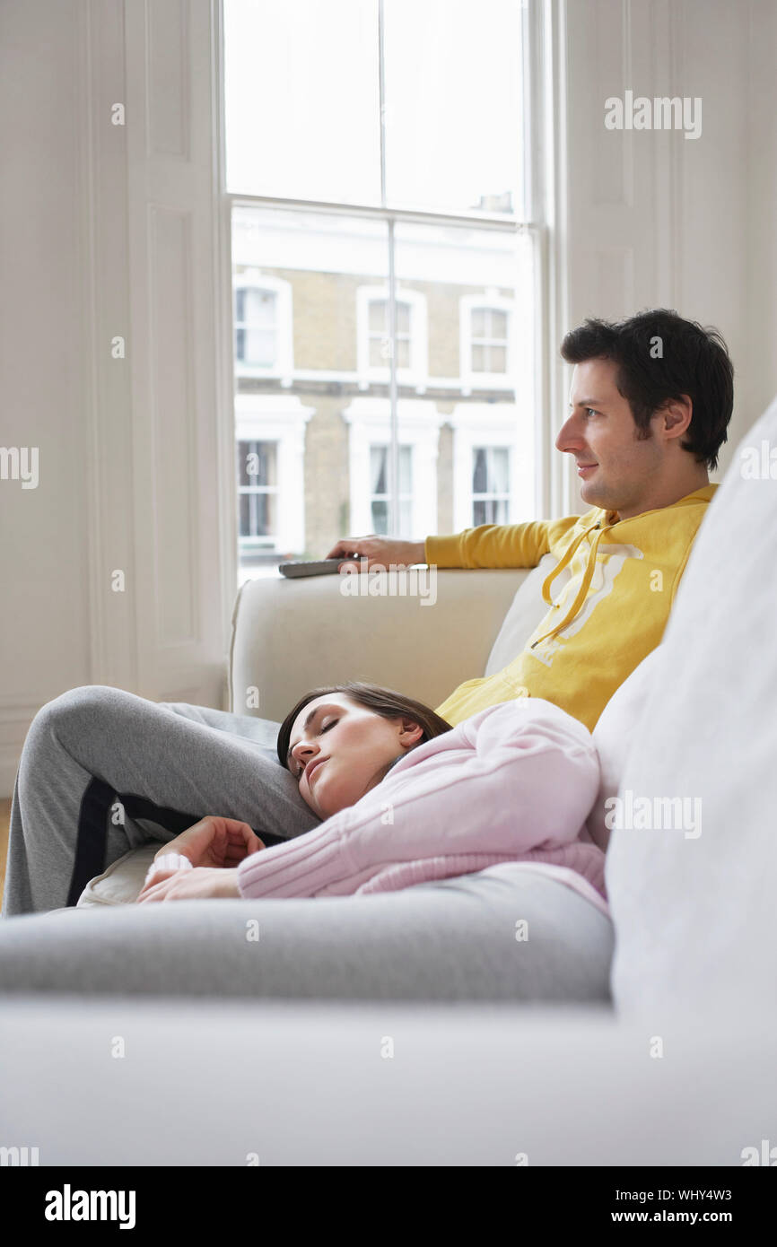 Young woman sitting on mans lap hi-res stock photography and images - Alamy