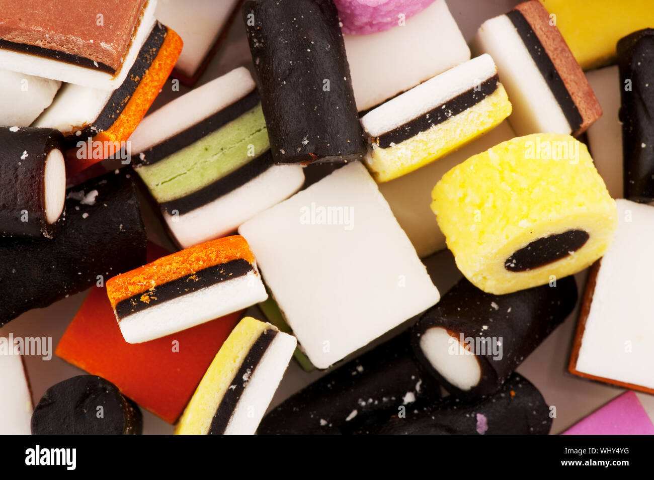 All sort licorice candy sweets isolated over white Stock Photo - Alamy