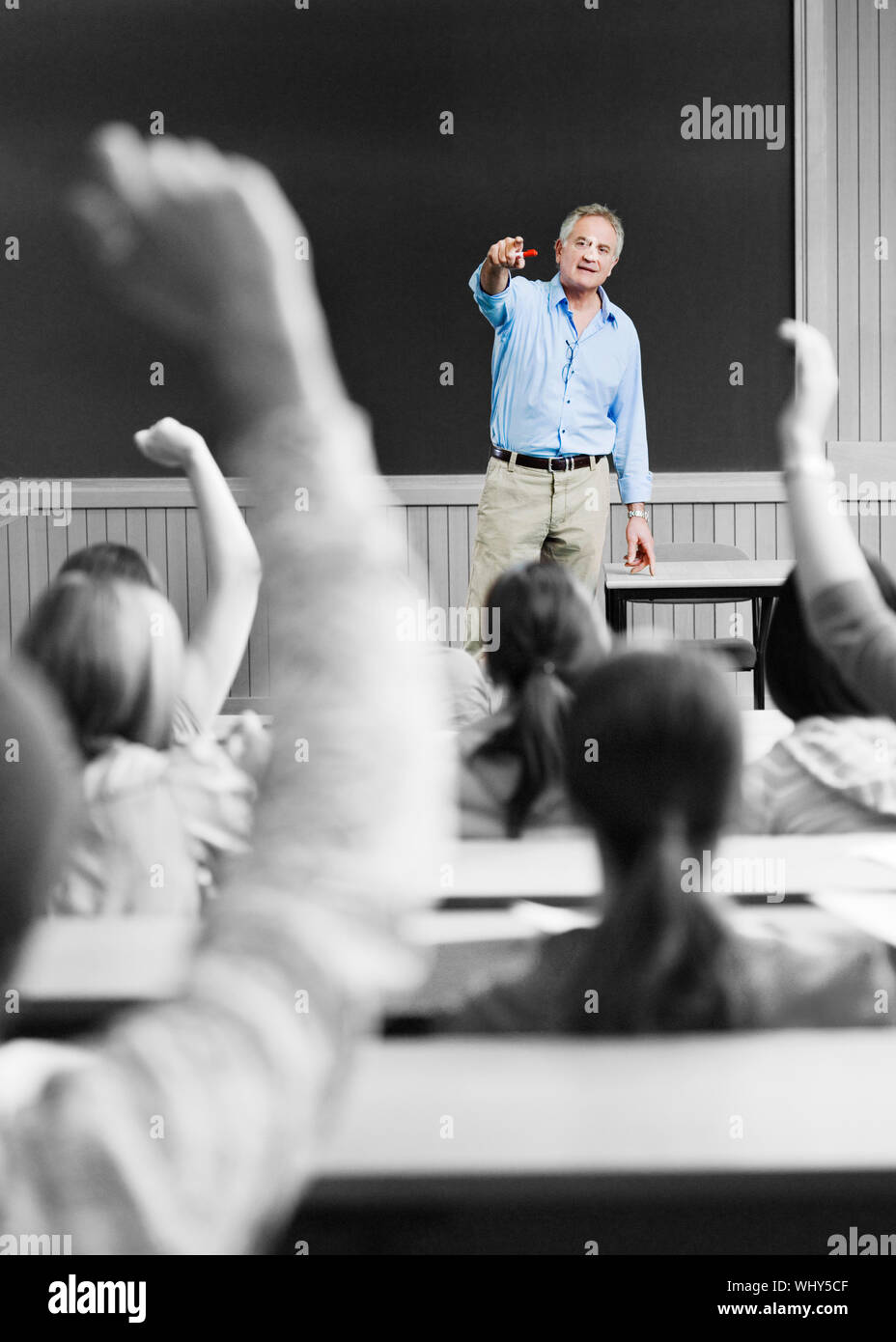 Hands raised in classroom strategy hi-res stock photography and images ...