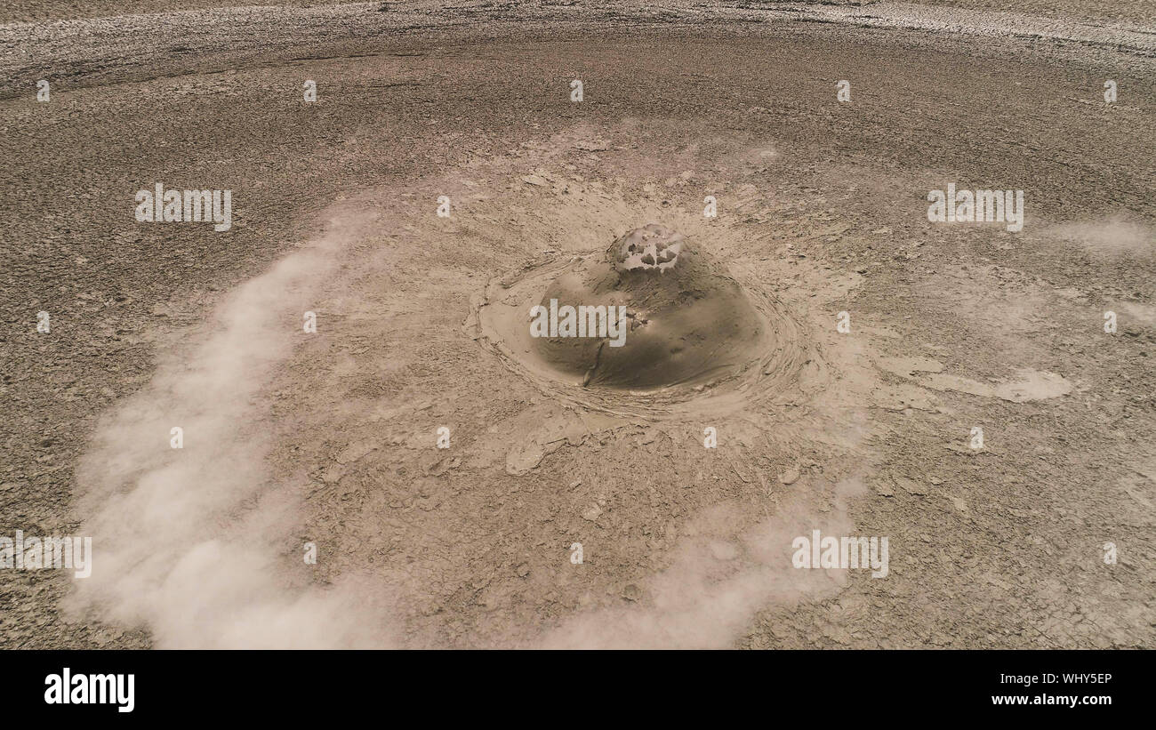Mud volcano with bursting bubble bledug kuwu. aerial view volcanic ...