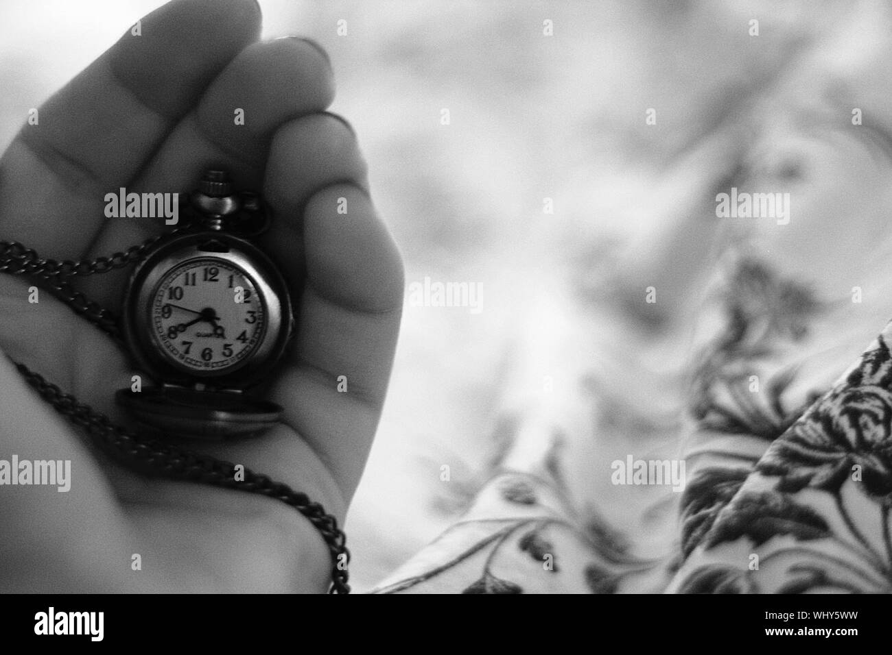 Hand holding pocket watch Black and White Stock Photos & Images - Alamy