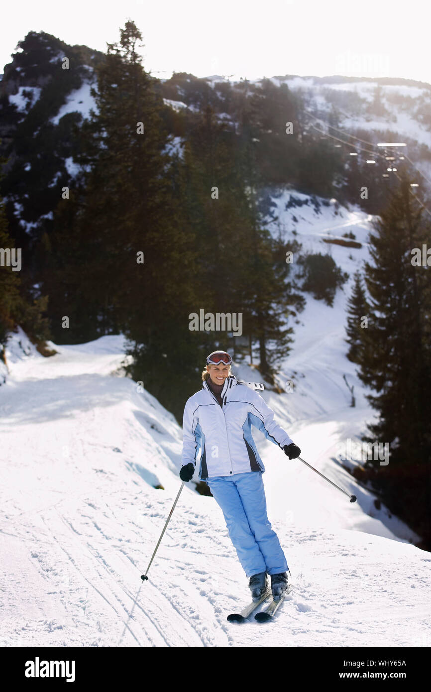 Female skiing down a slope hi-res stock photography and images - Alamy