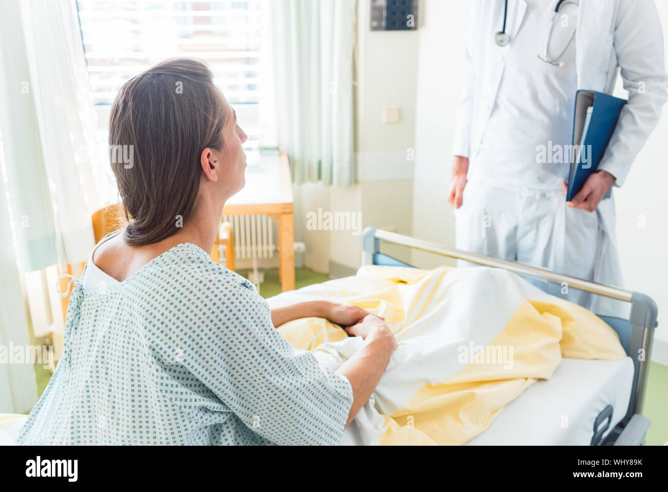 Doctor seeing patient in hospital Stock Photo - Alamy